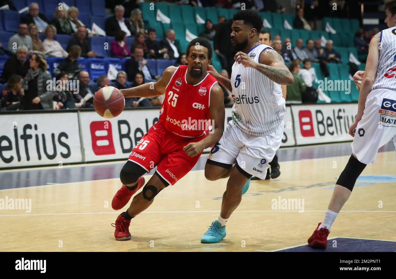 Charleroi's Cliff Hammonds and Mons' Chris Jones fight for the ball ...