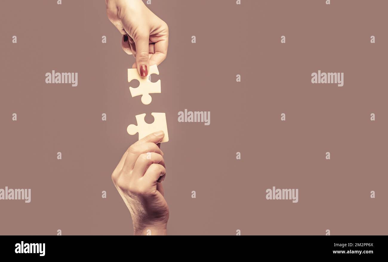 Hands hold puzzles. Solution of problems. Mens and childs hands ...