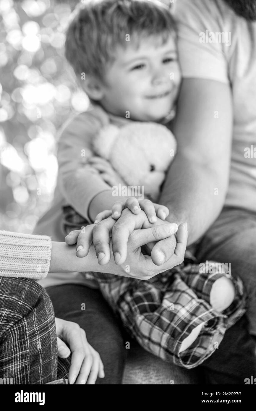 Concept of unity, support, protection, happiness. Child hand closeup ...