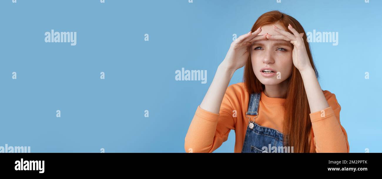 Worried clingy redhead girlfriend spying boyfriend peer from distance ...