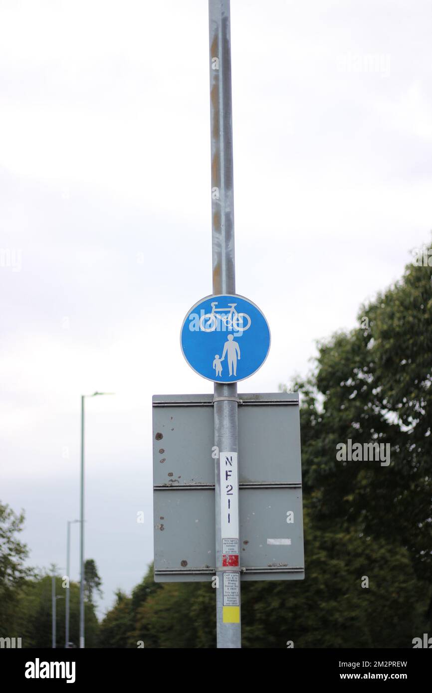 A bicycle sign hanging on pole Stock Photo - Alamy