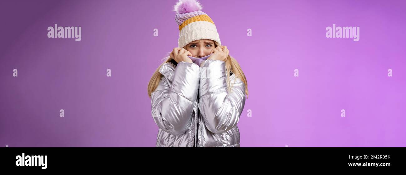 Scared afraid insecure coward girl in cute hat glittering shiny jacket ...
