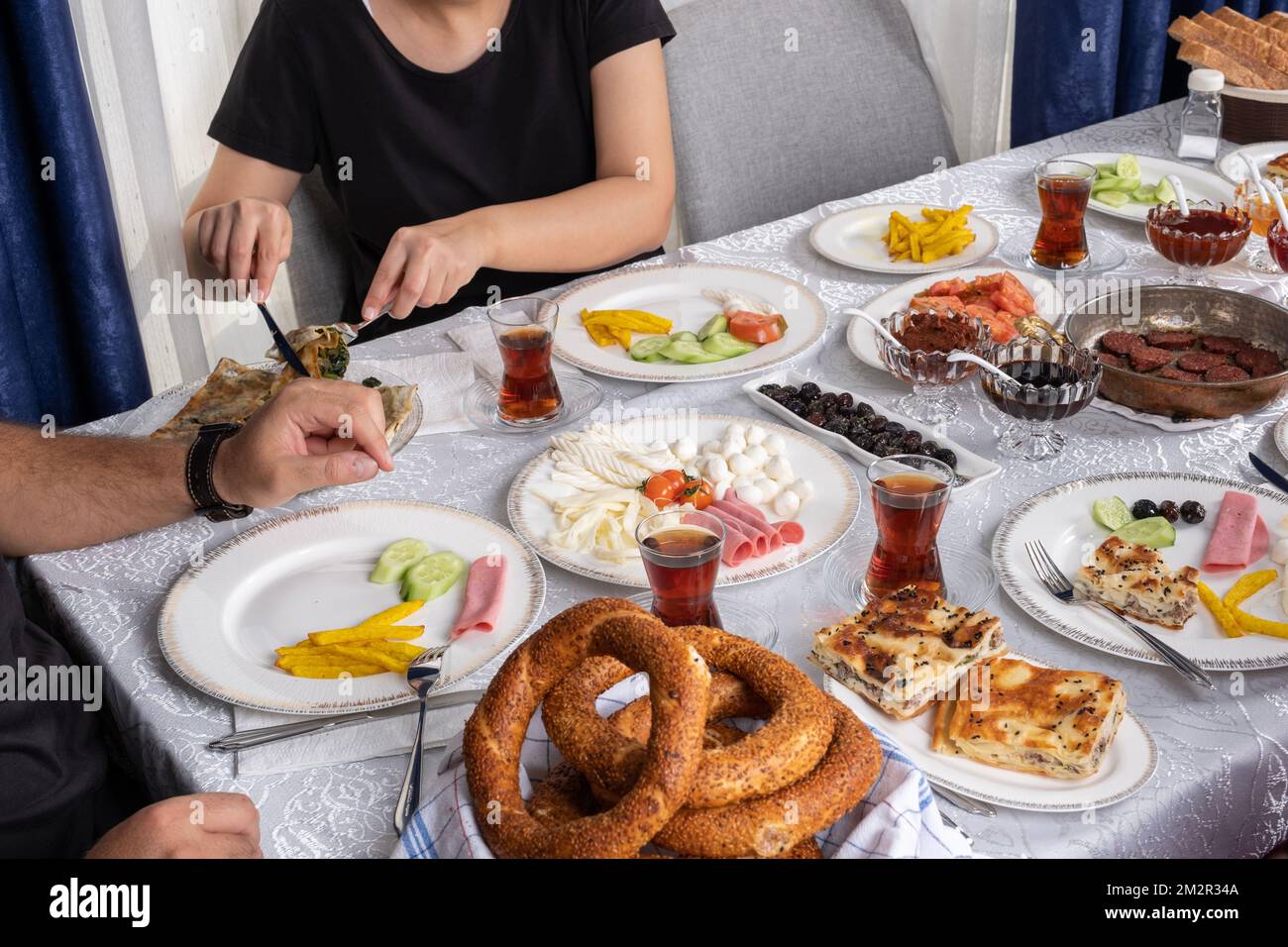 Rich and delicious breakfast table at family reunion. Modern Turkish ...