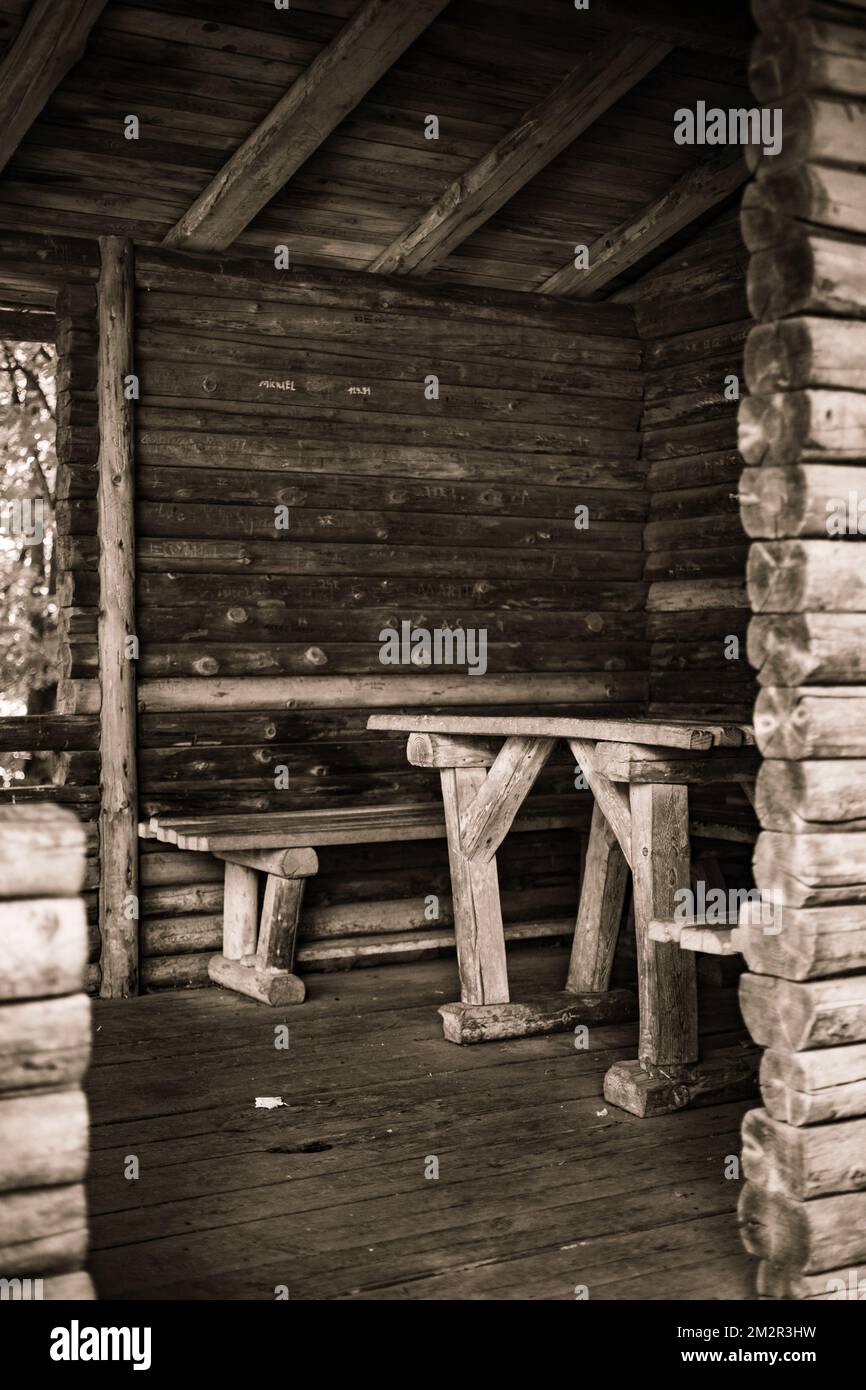 An interior of pavilion with wooden table and seats Stock Photo - Alamy