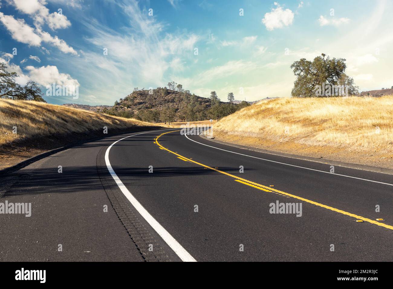 Asphalt road and country landscape Stock Photo - Alamy