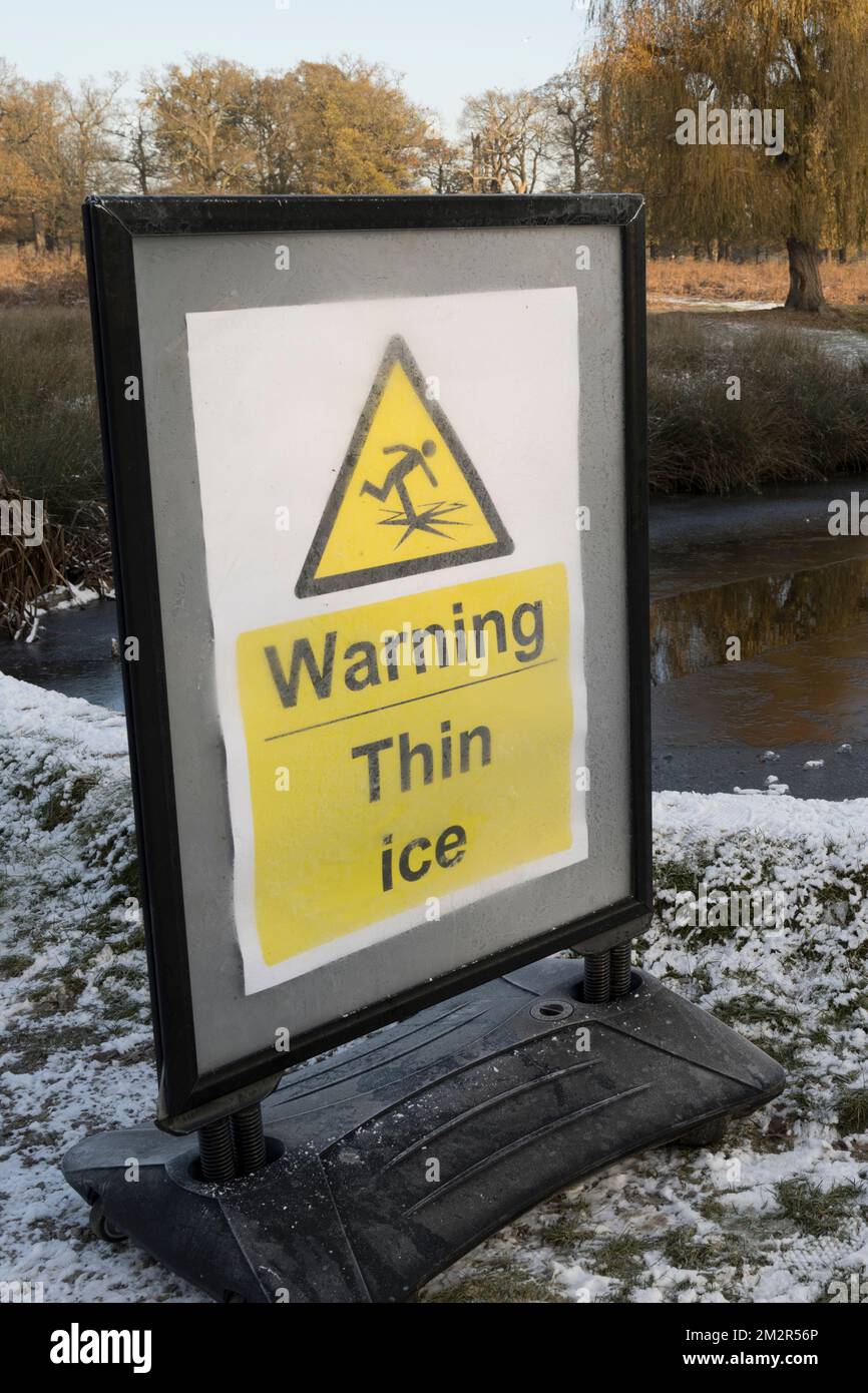 Thin ice with warning sign Stock Photo - Alamy