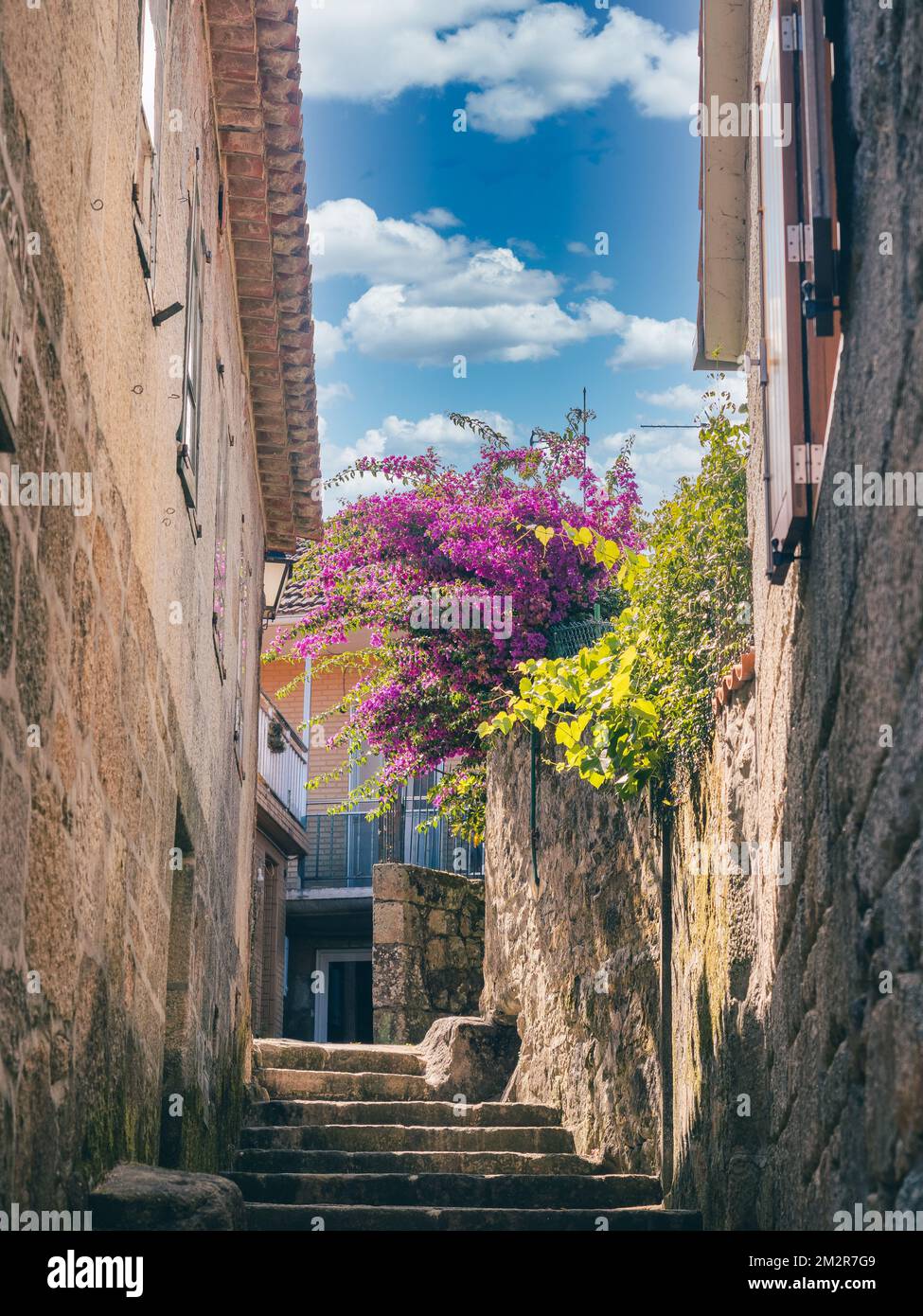 A vertical shot of a stone building and narrow staircase Stock Photo ...