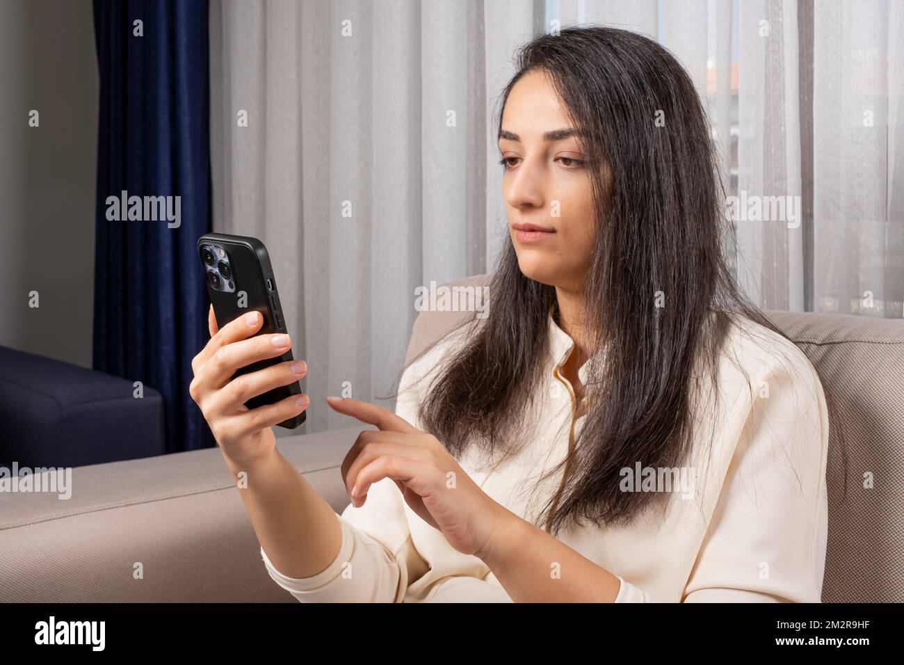 Holding smartphone, caucasian millennial woman. Using cell phone ...
