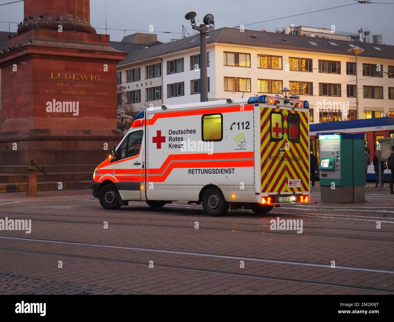 An emergency ambulance of the German Red Cross in Luisenplatz square ...