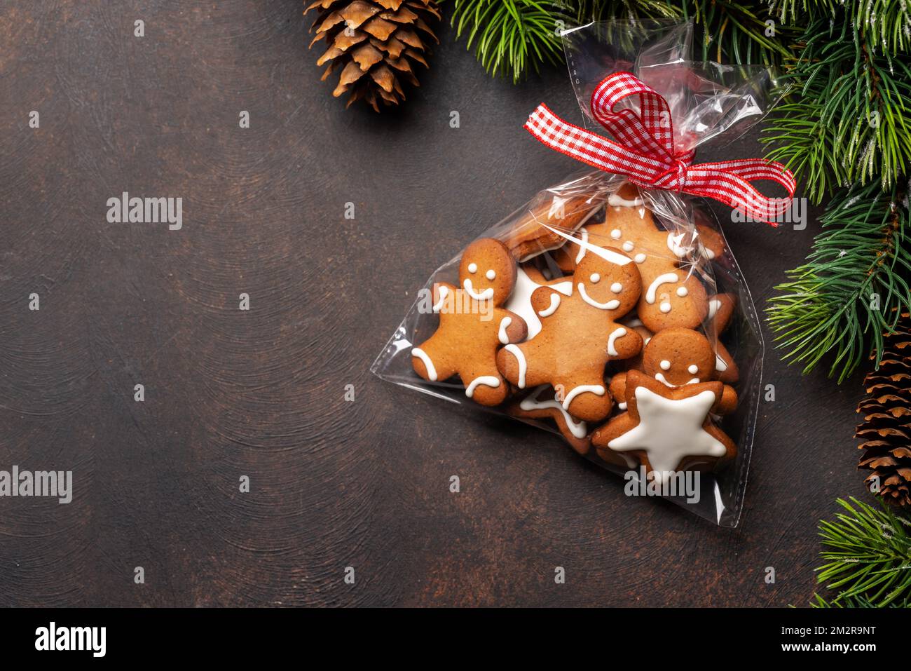 Gingerbread man cookies in gift package. Christmas holiday card with ...
