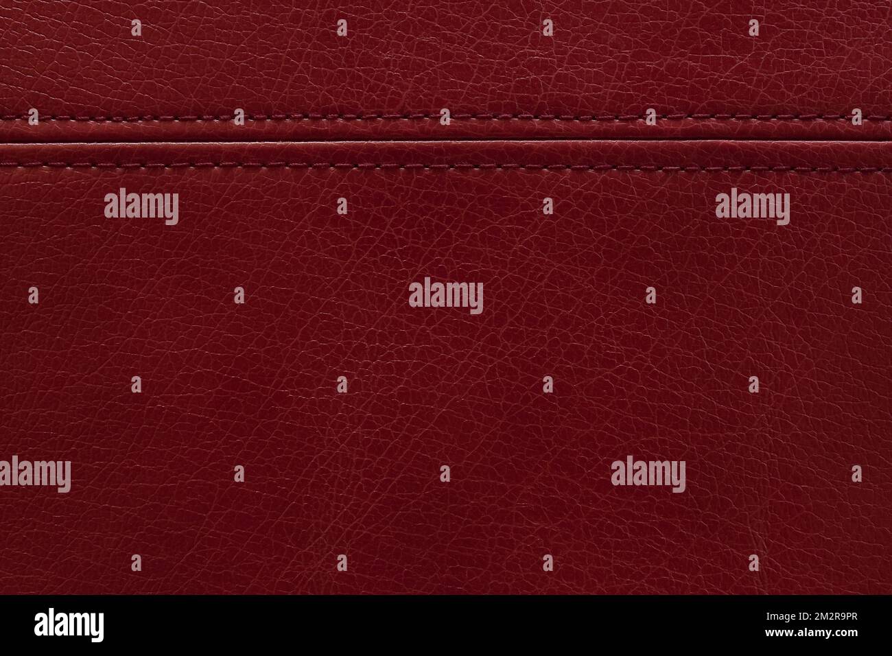Red leather texture background with a horizontal seam Stock Photo - Alamy