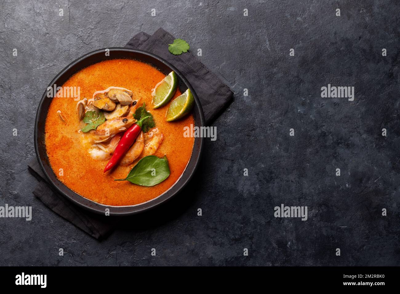 Thai Tom Yum Soup with seafood. Flat lay with copy space Stock Photo ...