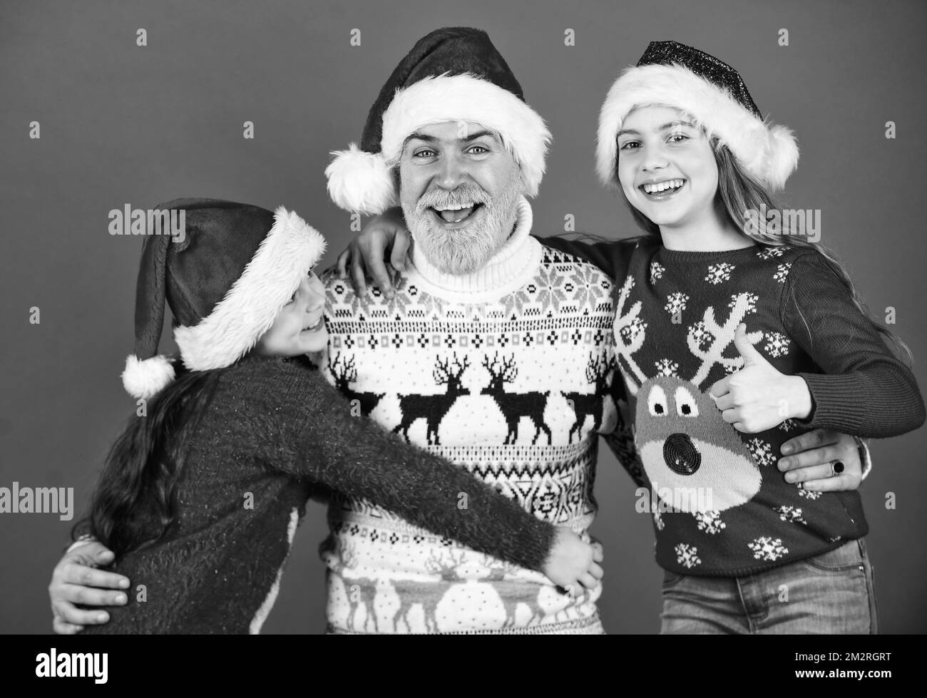 happy family celebrate xmas. small girls love their father. dad embrace ...