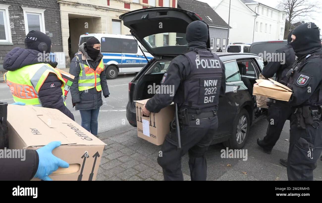 Solingen, Germany. 14th Dec, 2022. Police officers carry seized ...