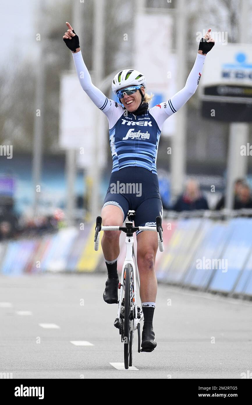 Dutch Ellen Van Dijk celebrates as she crosses the finish line to win ...