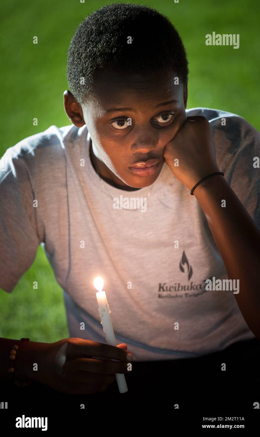 Illustration picture shows a young Rwandese with candle during a vigil ...