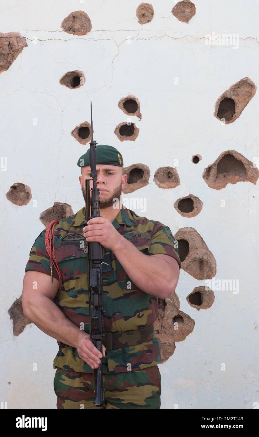 A soldier stands guard at a commemoration on the 'Camp Kigali' site ...