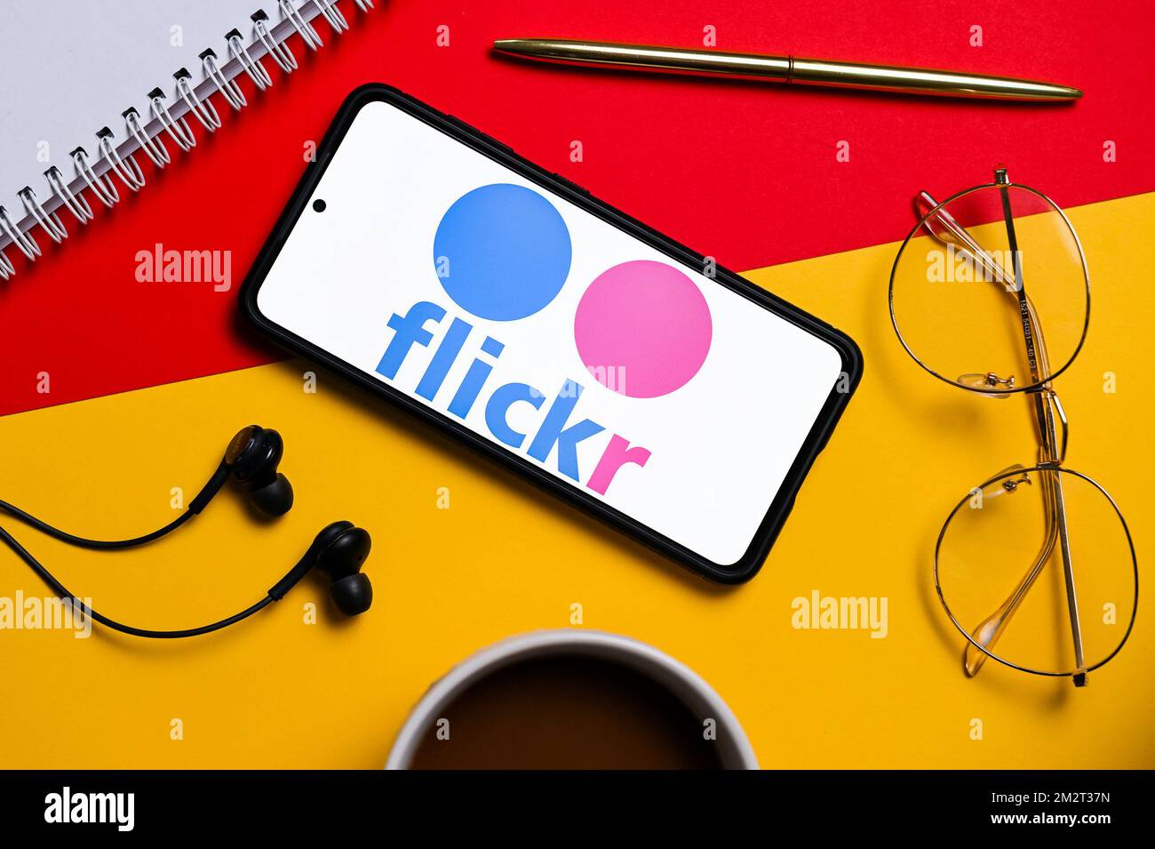 In this photo illustration a Flick logo seen displayed on a smartphone ...