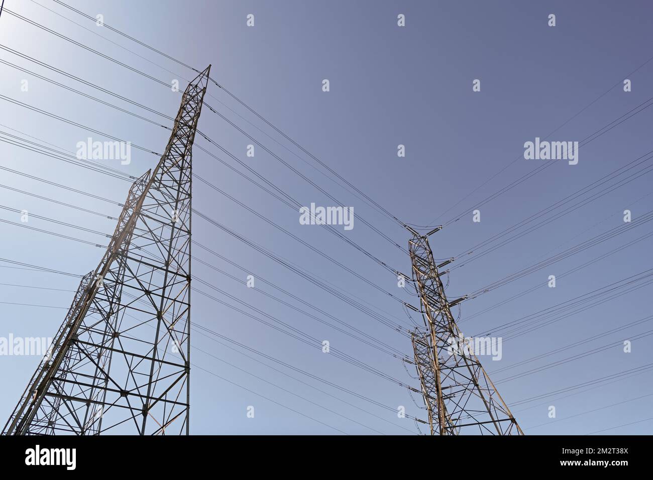 electrical power lines of pylon producing energy with voltage ...