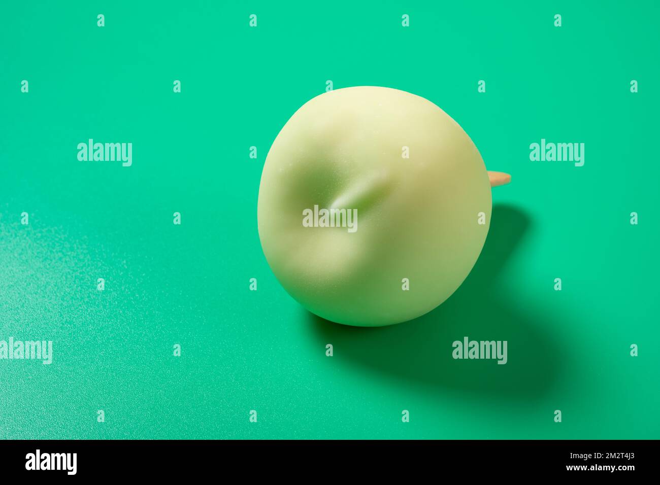 fresh green apple shape and flavor popsice on green background Stock ...