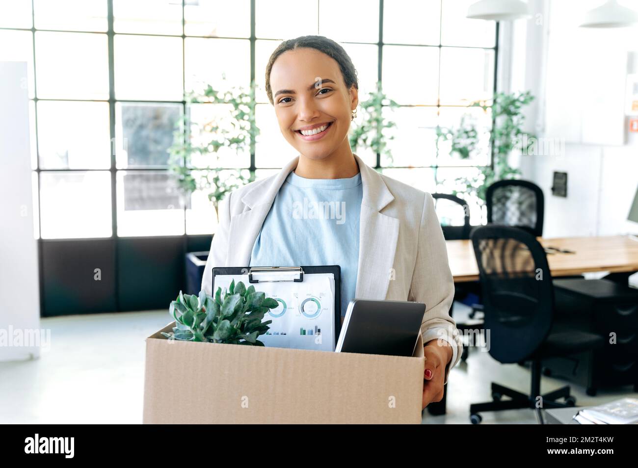 Got a new job. Joyful brazilian business lady, female trainee, in ...