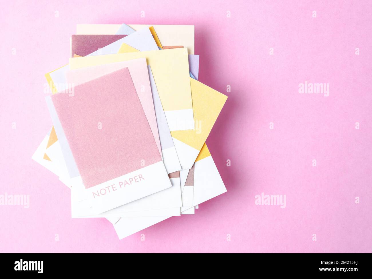 Colorful blank sticky note papers on pink colour background for your ...