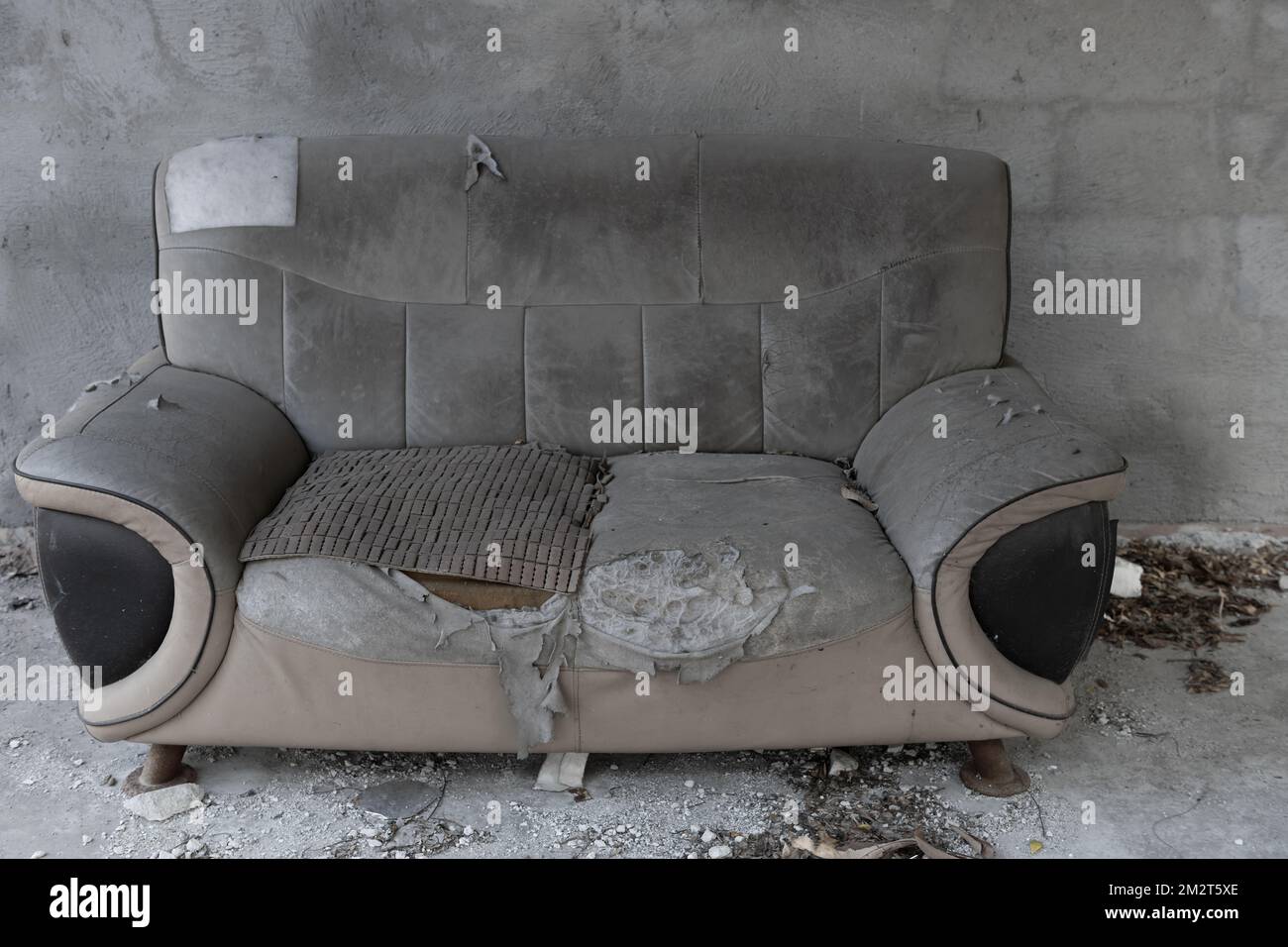 badly damaged sofa at horizontal composition Stock Photo - Alamy