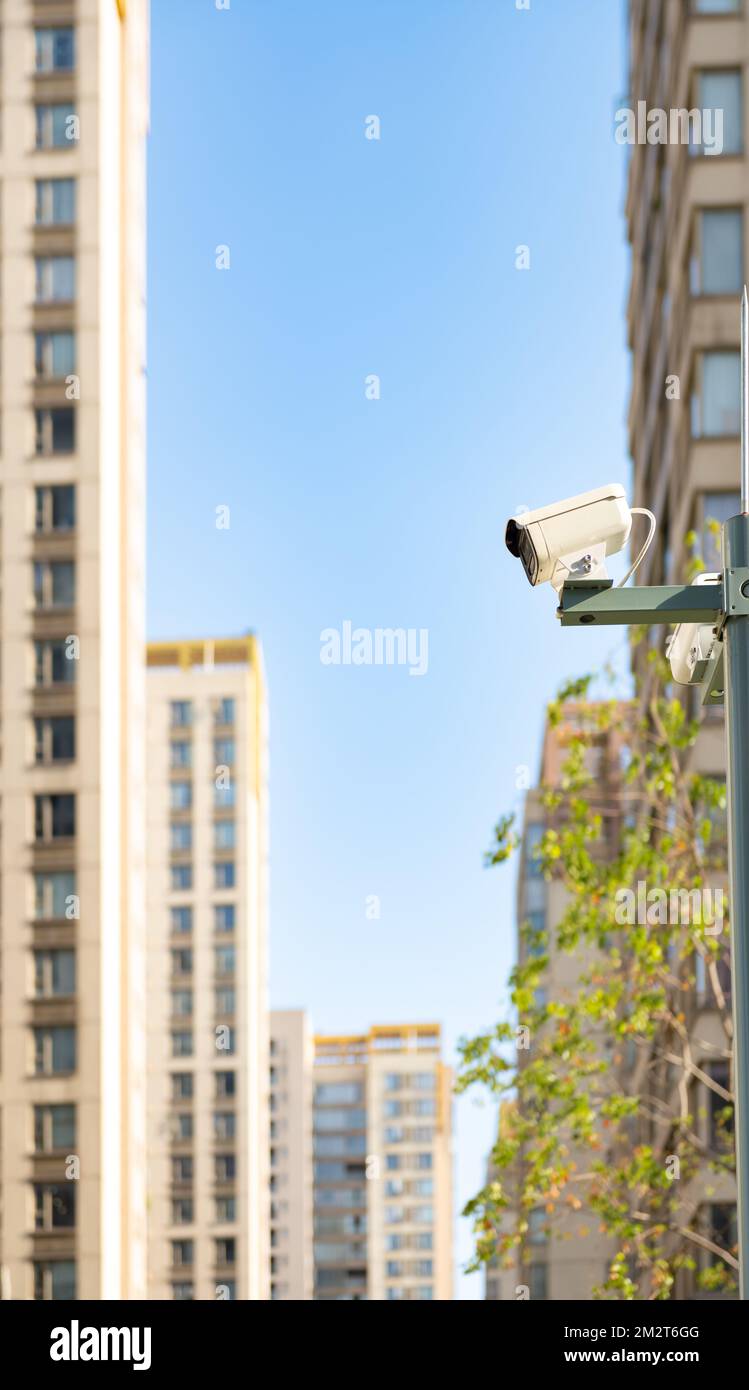 CCTV cameras and residential buildings on back vertical composition ...