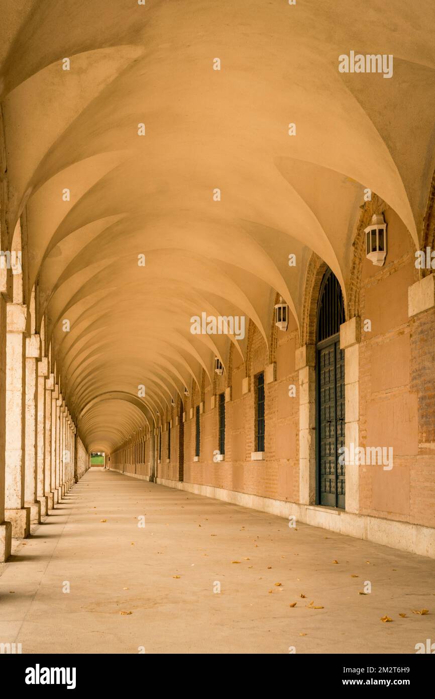 A corridor in an old building with columns Stock Photo - Alamy