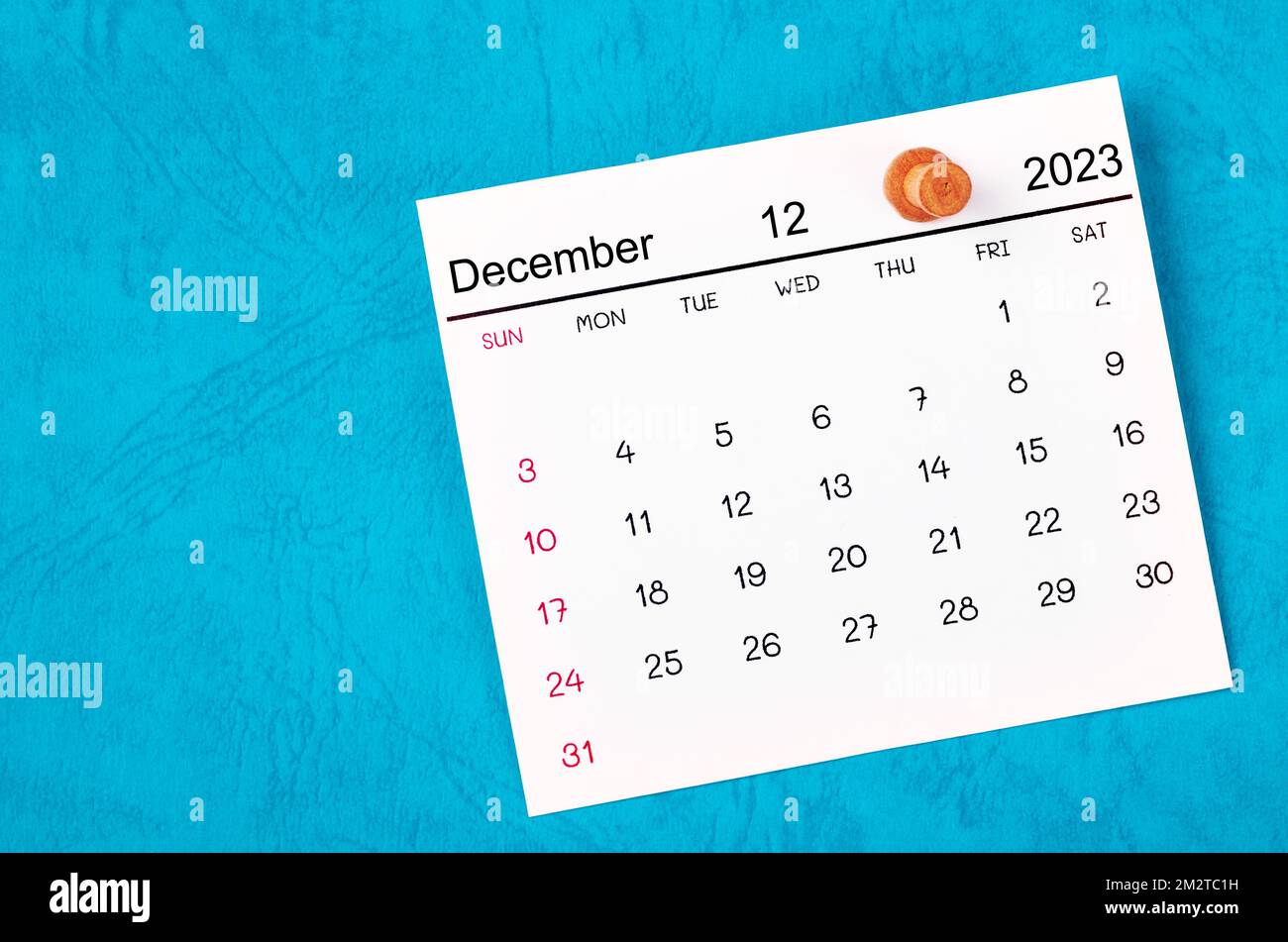 December 2023 and wooden push pin on blue background Stock Photo - Alamy