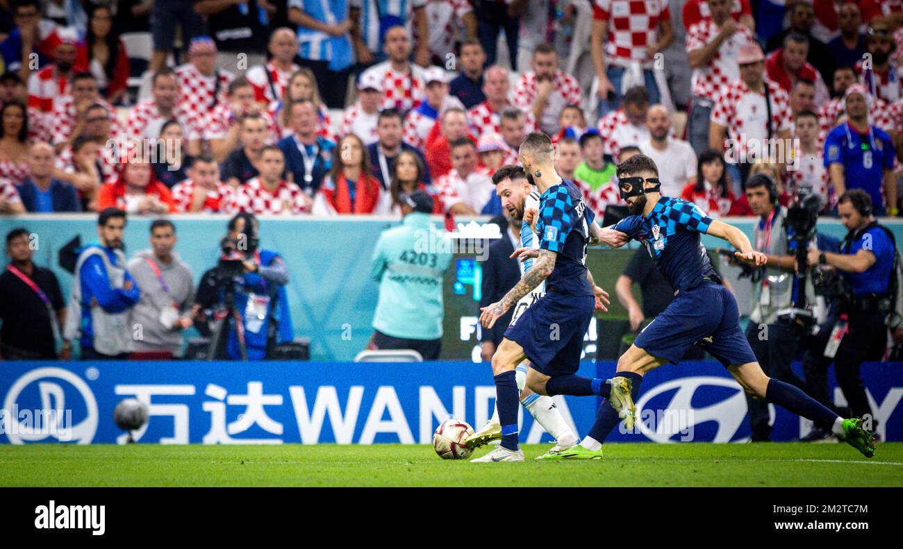 Doha, Qatar. 13th Dec, 2022. Lionel Messi (Arg), Marcelo Brozovic ...