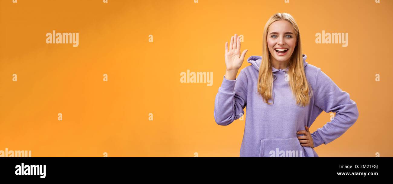 Friendly energized helpful charming female student say hello newcomers ...