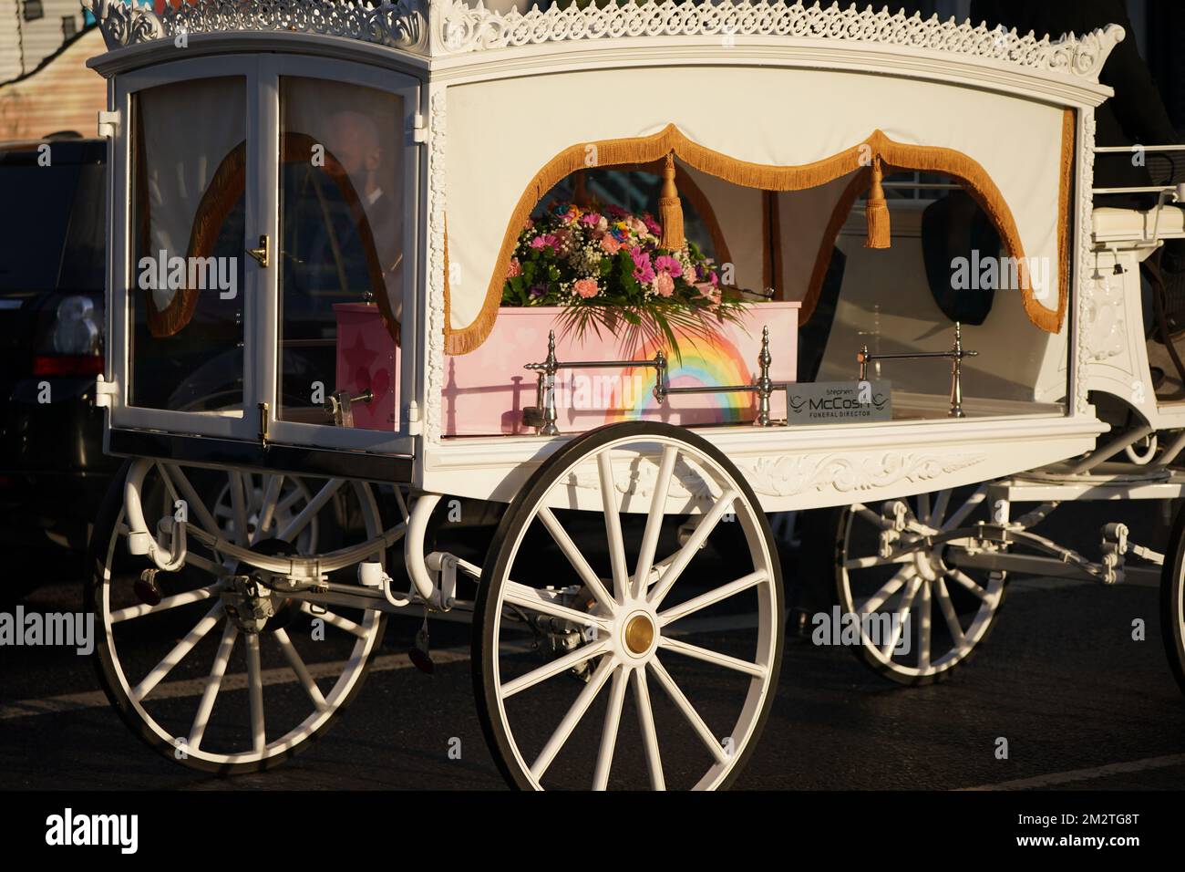 The horse-drawn carriage carrying the coffin of Stella-Lily ...