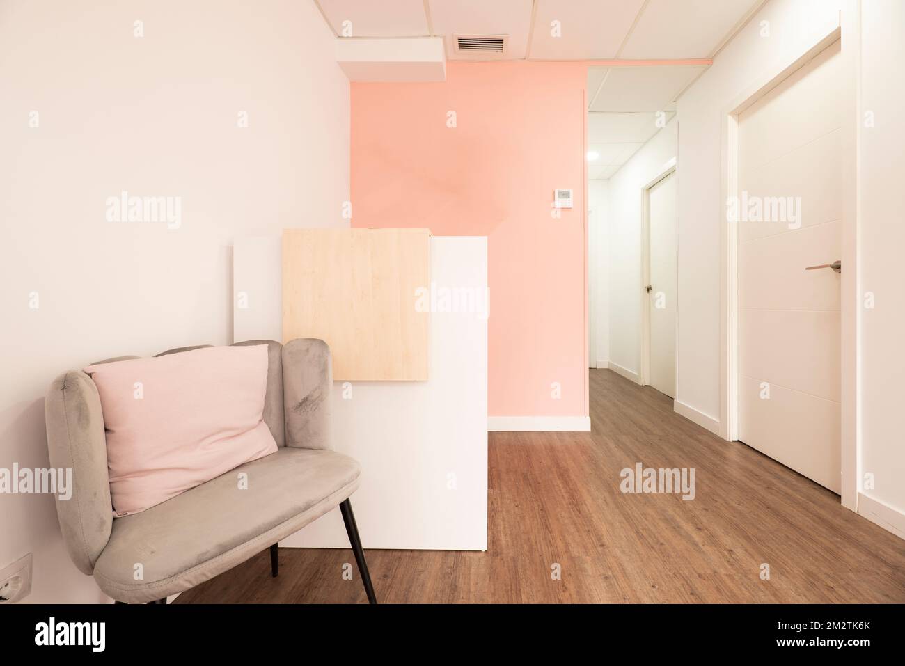 Hallway of a beauty salon with booths to apply treatments and gray ...