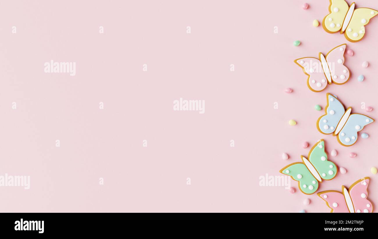 Easter butterfly gingerbread cookies with egg candies on pink ...