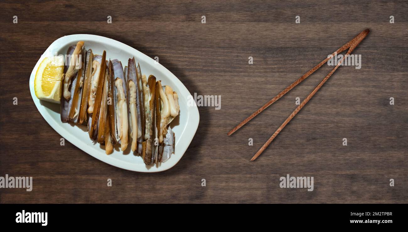 Grilled Razor Clams with lemon ready to eat served at White Platter on ...