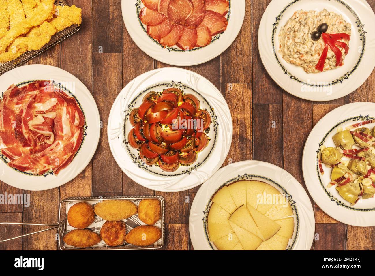 Large set of dishes of Spanish gastronomy and varied tapas with ...