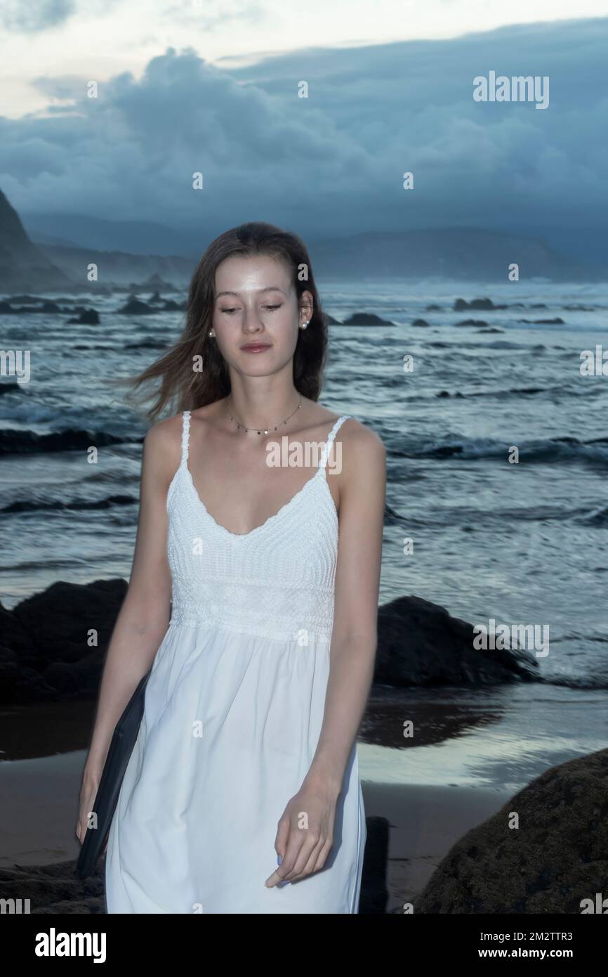 Young woman using laptop on a beach. freelance work concept Stock Photo ...