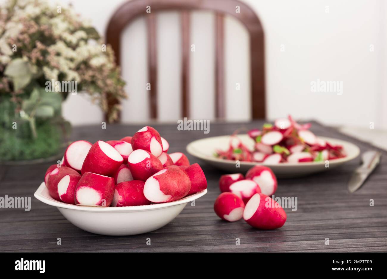cooked crispy radish in white bowl on wooden table Stock Photo - Alamy