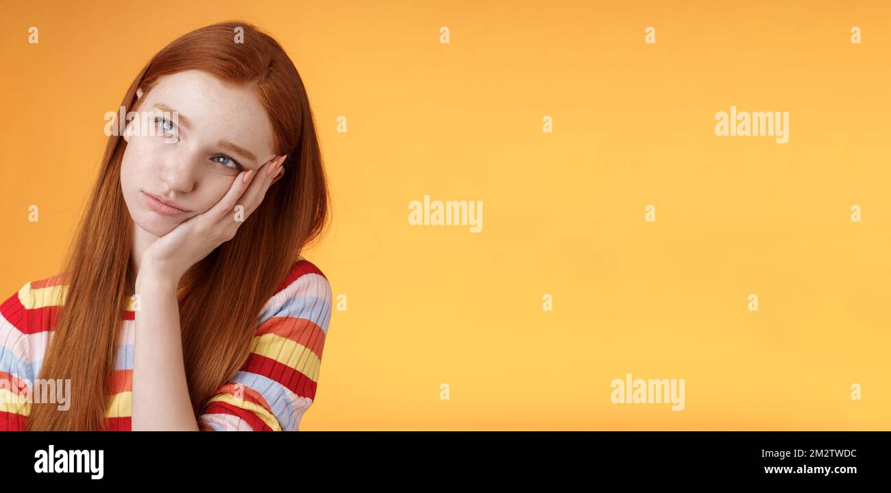 Lonely upset moody cute redhead girlfriend feeling boredom leaning palm ...