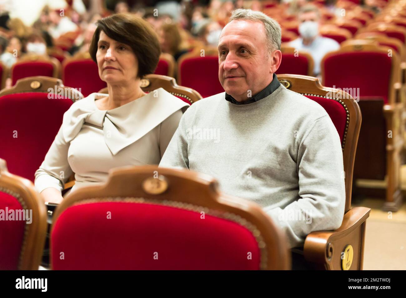 in the theater, a man and a woman watch a performance Stock Photo - Alamy