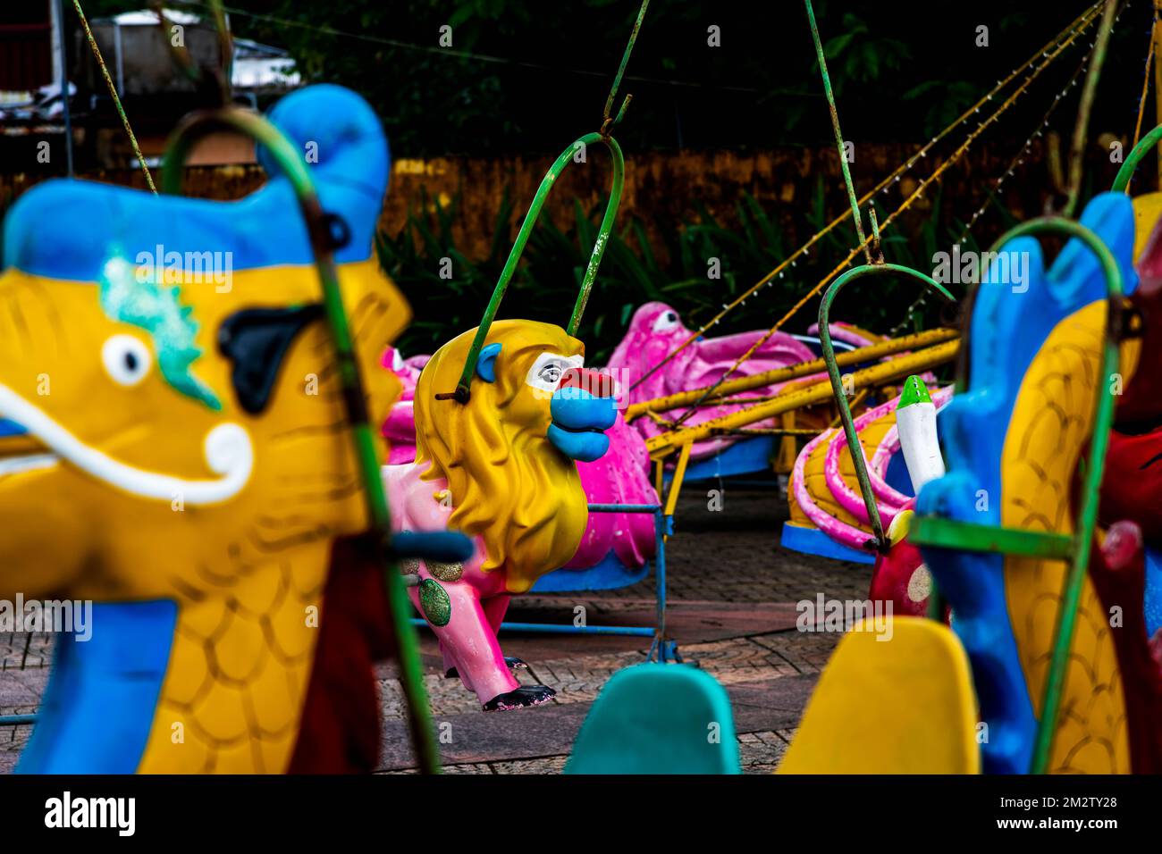 A colorful Vietnamese merry-go-round with dragons and lions in Hoi An ...