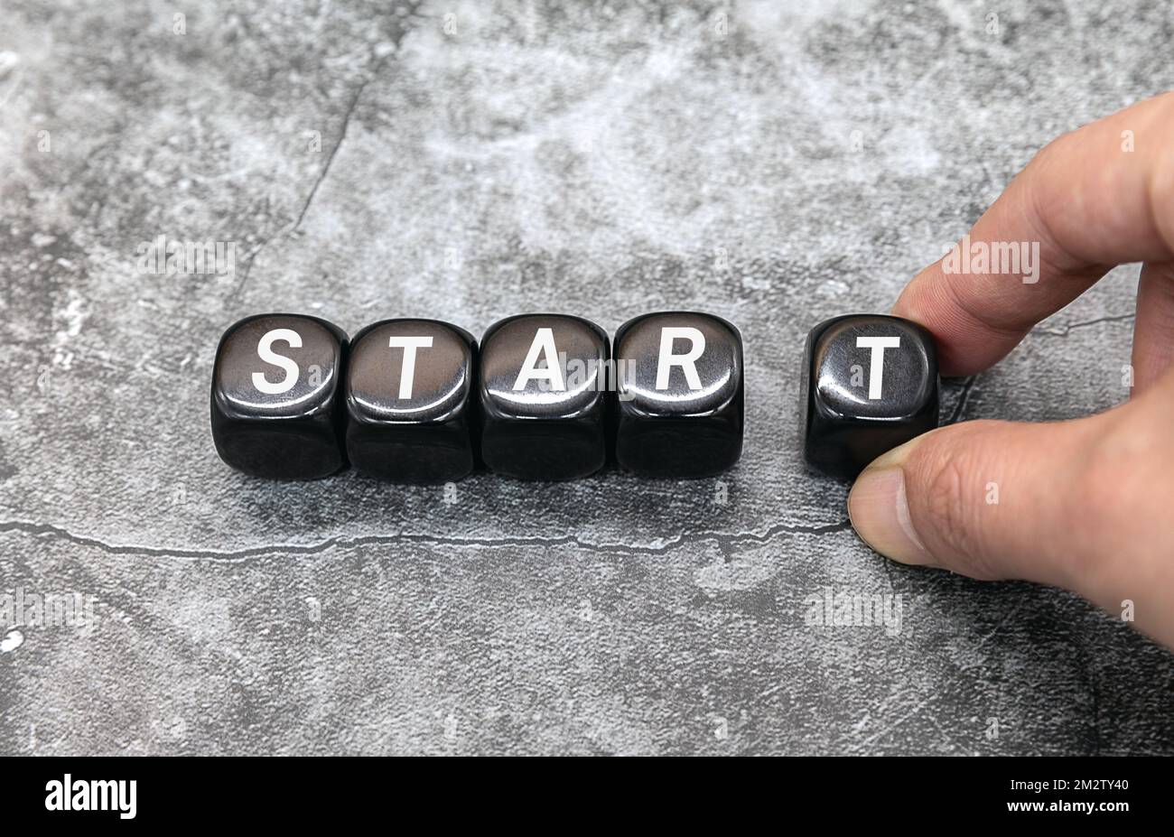 Start to stars symbol. Businessman turns a wooden cube and changes the ...