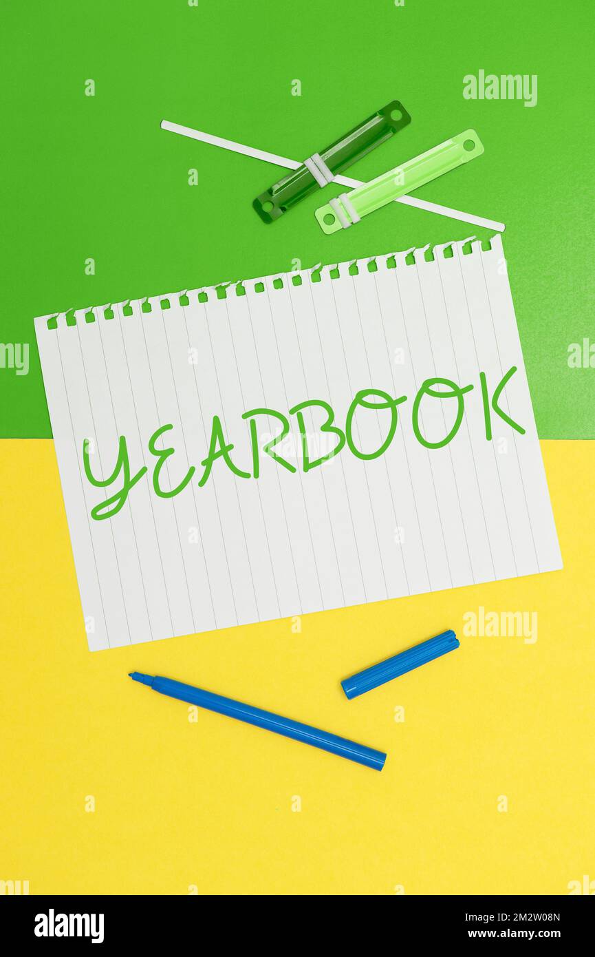 Sign displaying Yearbook. Word Written on publication compiled by ...