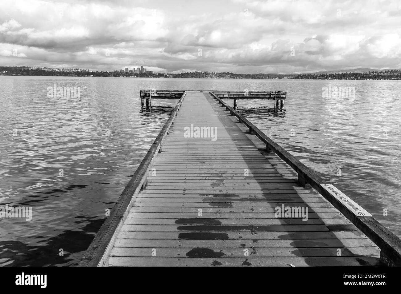 A pier points toward Bellvue, Washington and a loak shoreline Stock ...