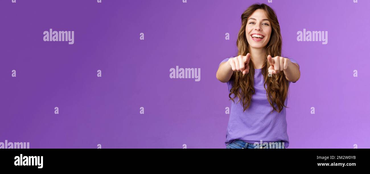 Its you. Friendly glad joyful happy curly-haired girl pointing fingers ...