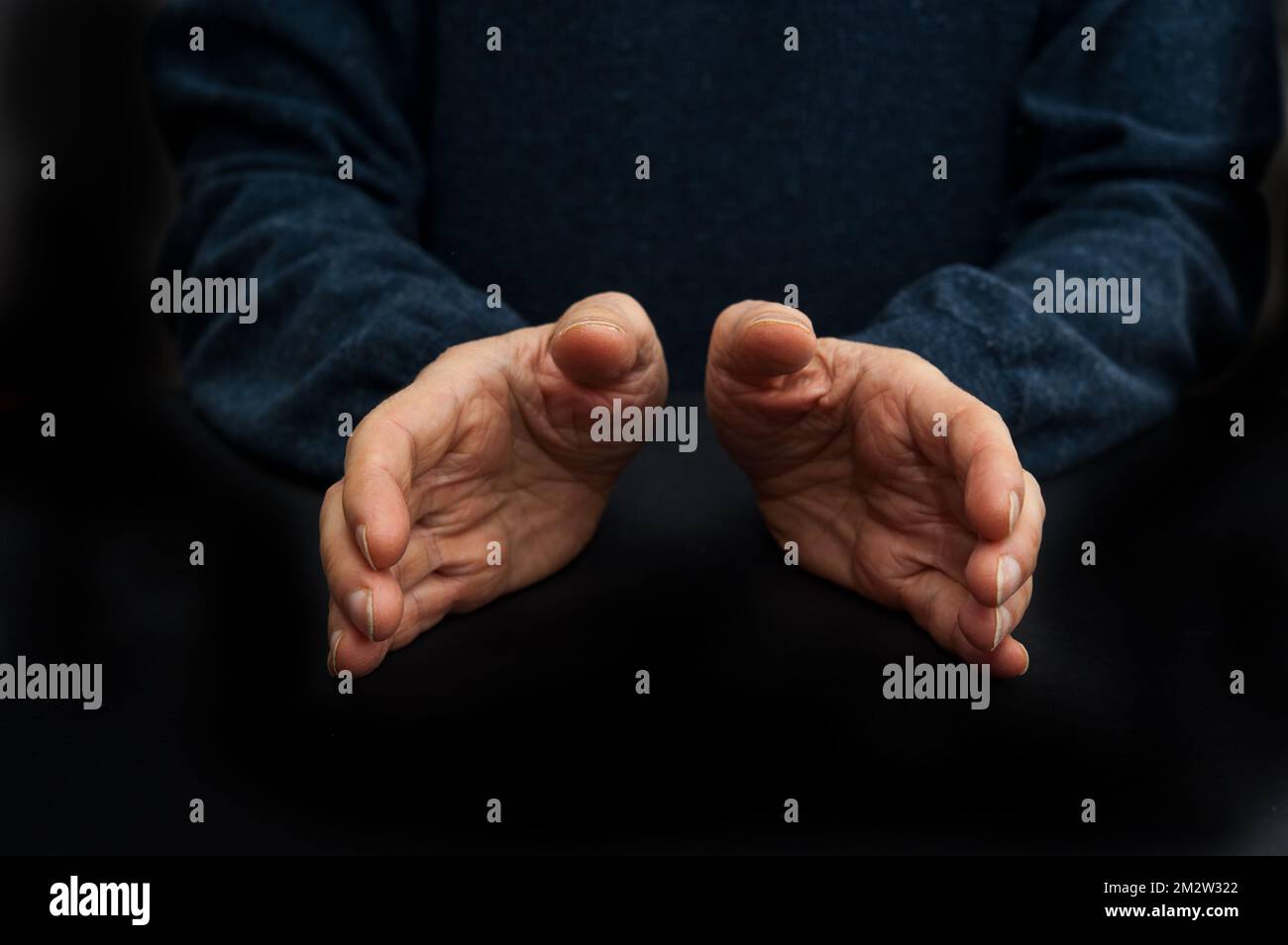 Protecting hands hi-res stock photography and images - Alamy