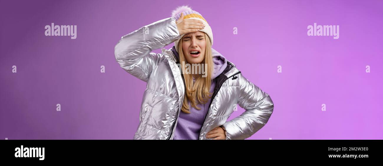 Girl sick tired touch forehead painful feeling grimacing complaining ...