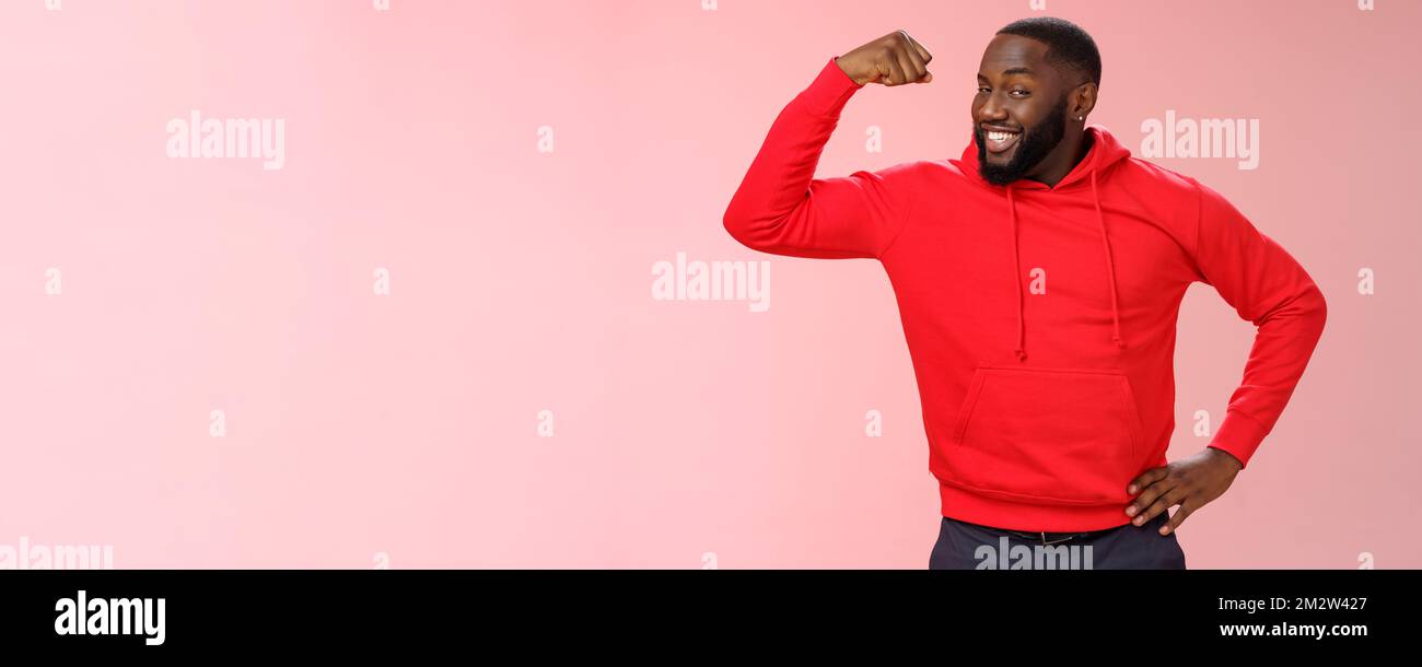 Charming cheeky friendly african-american strong guy smiling broadly ...