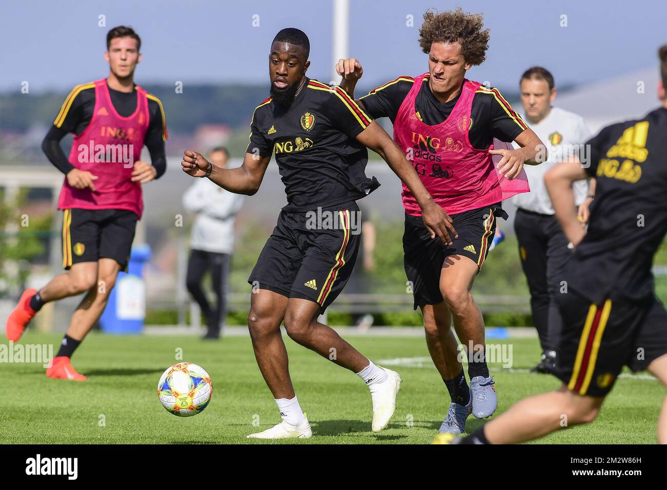Belgium's Isaac Mbenza and Belgium's Wout Faes fight for the ball ...